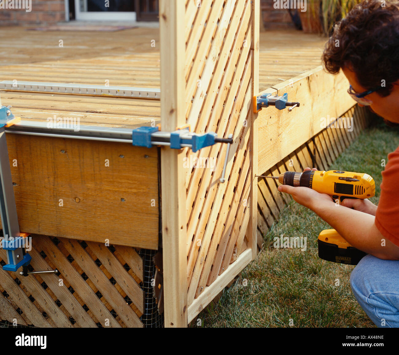 Man Building Deck Stock Photo - Alamy