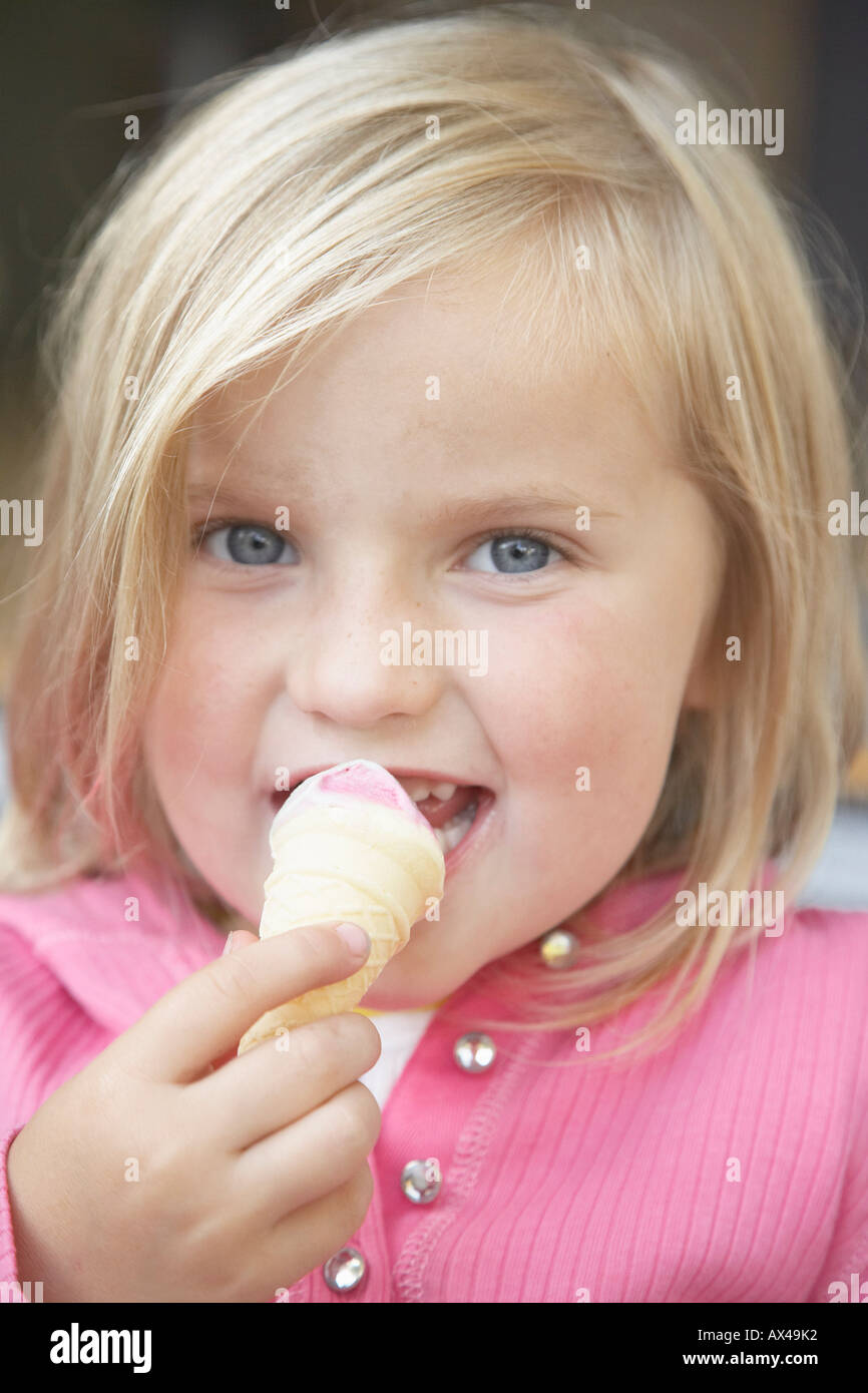 Girl Eating Ice Cream Cone Stock Photo - Alamy