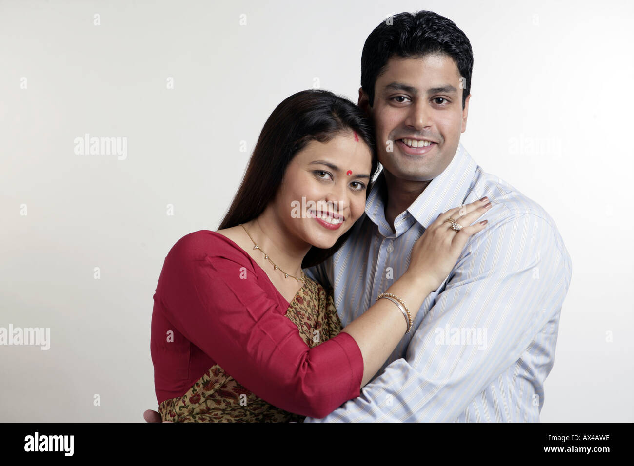 Portrait of a couple hugging and smiling Stock Photo - Alamy