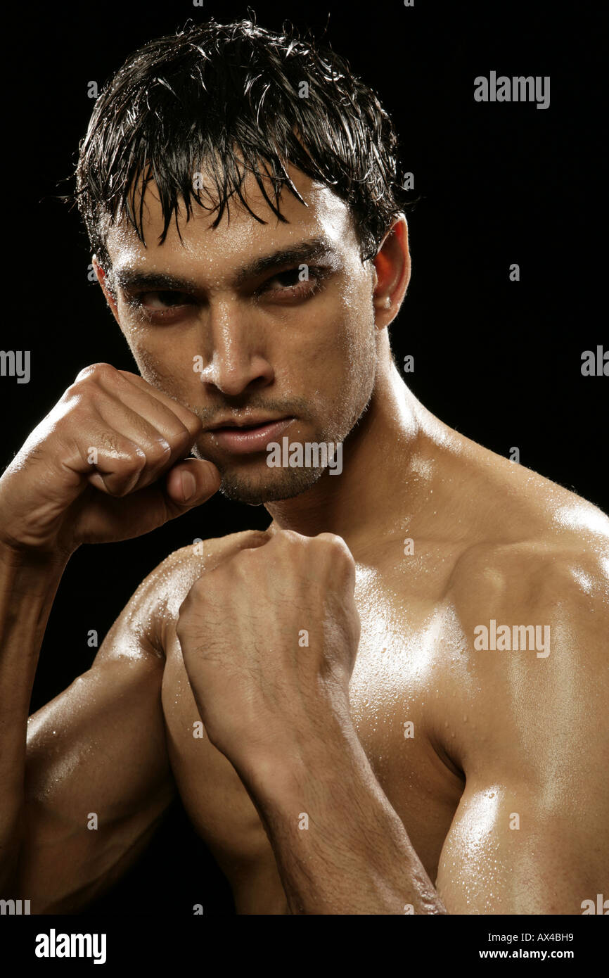 Portrait of a bare chest man showing punch Stock Photo - Alamy