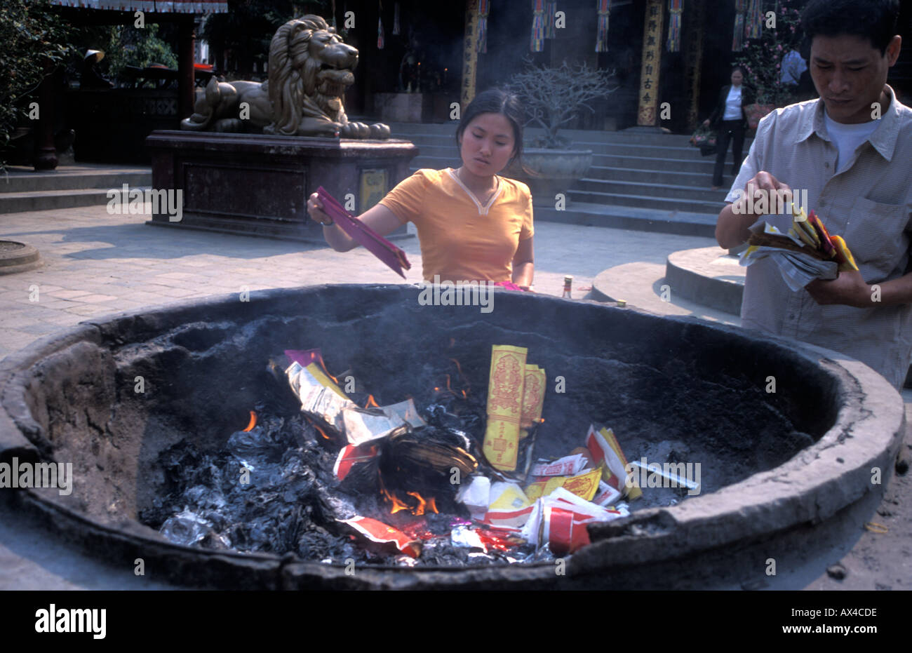 Woman burning money hi-res stock photography and images - Alamy