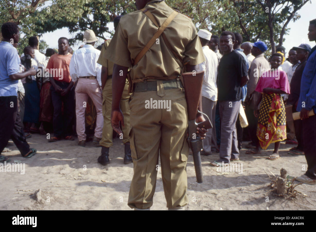 Unhcr police control crowd food distribution gun hi-res stock ...