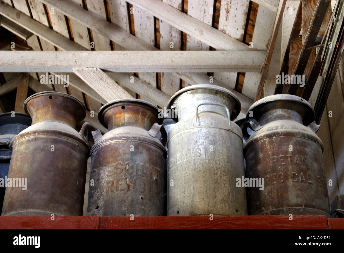 Dusty milk pails on a shelf at Laws Railroad Museum near Bishop ...