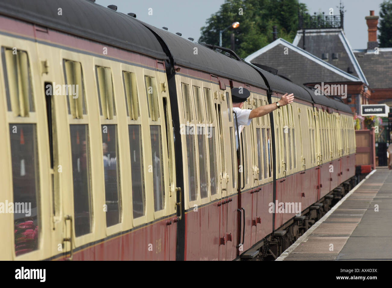 Steam train with carriages and guard at Kidderminster station on the ...
