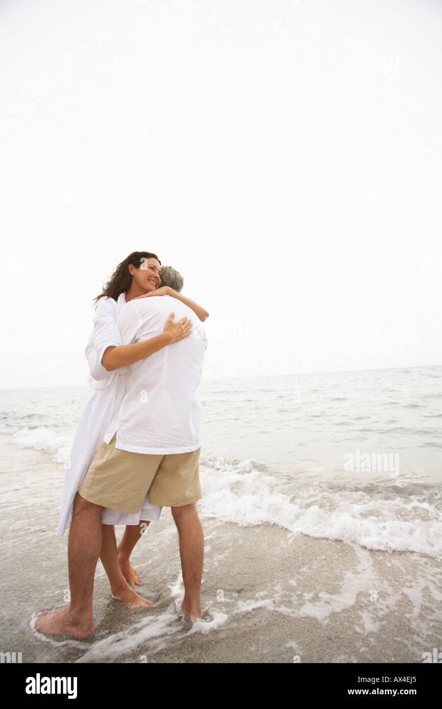 Couple Standing Cuddling Beach High Resolution Stock Photography and ...