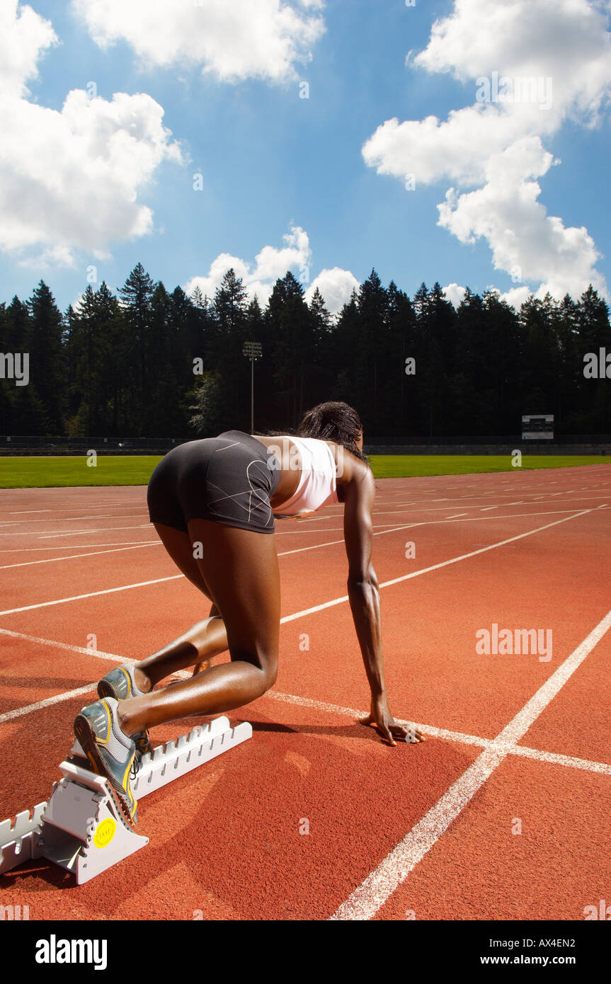 Woman sprinter in blocks hi-res stock photography and images - Alamy