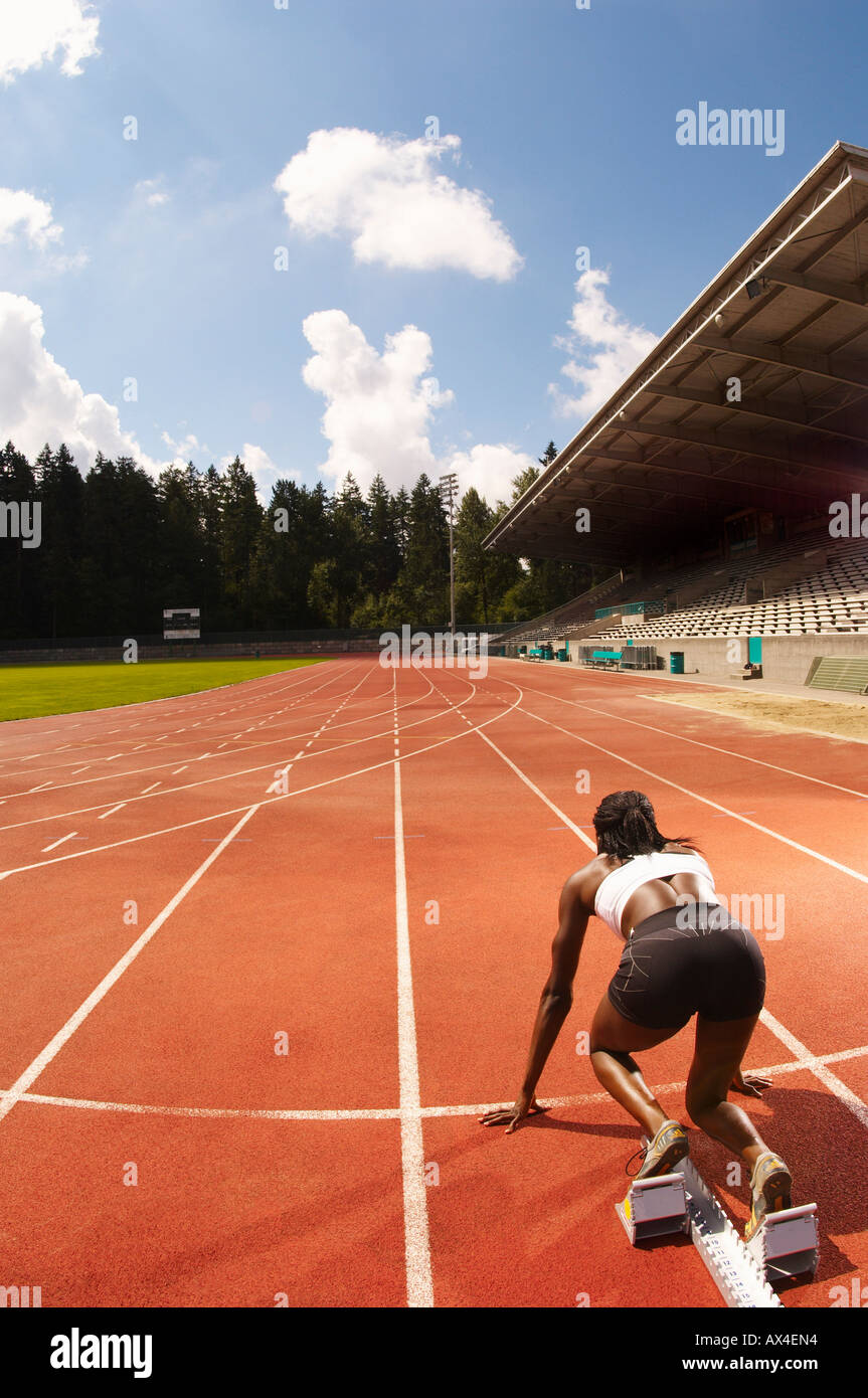 Woman sprinter in blocks hi-res stock photography and images - Alamy