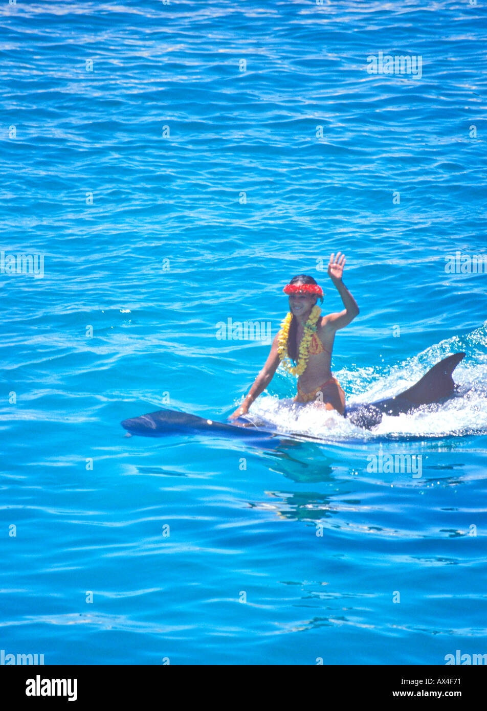 Girl riding dolphin hi-res stock photography and images - Alamy
