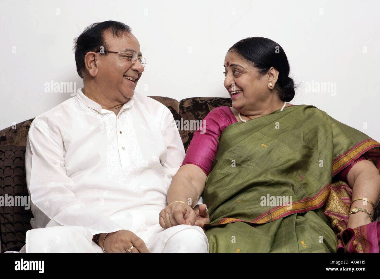 Indian senior couple laughing hi-res stock photography and images - Alamy