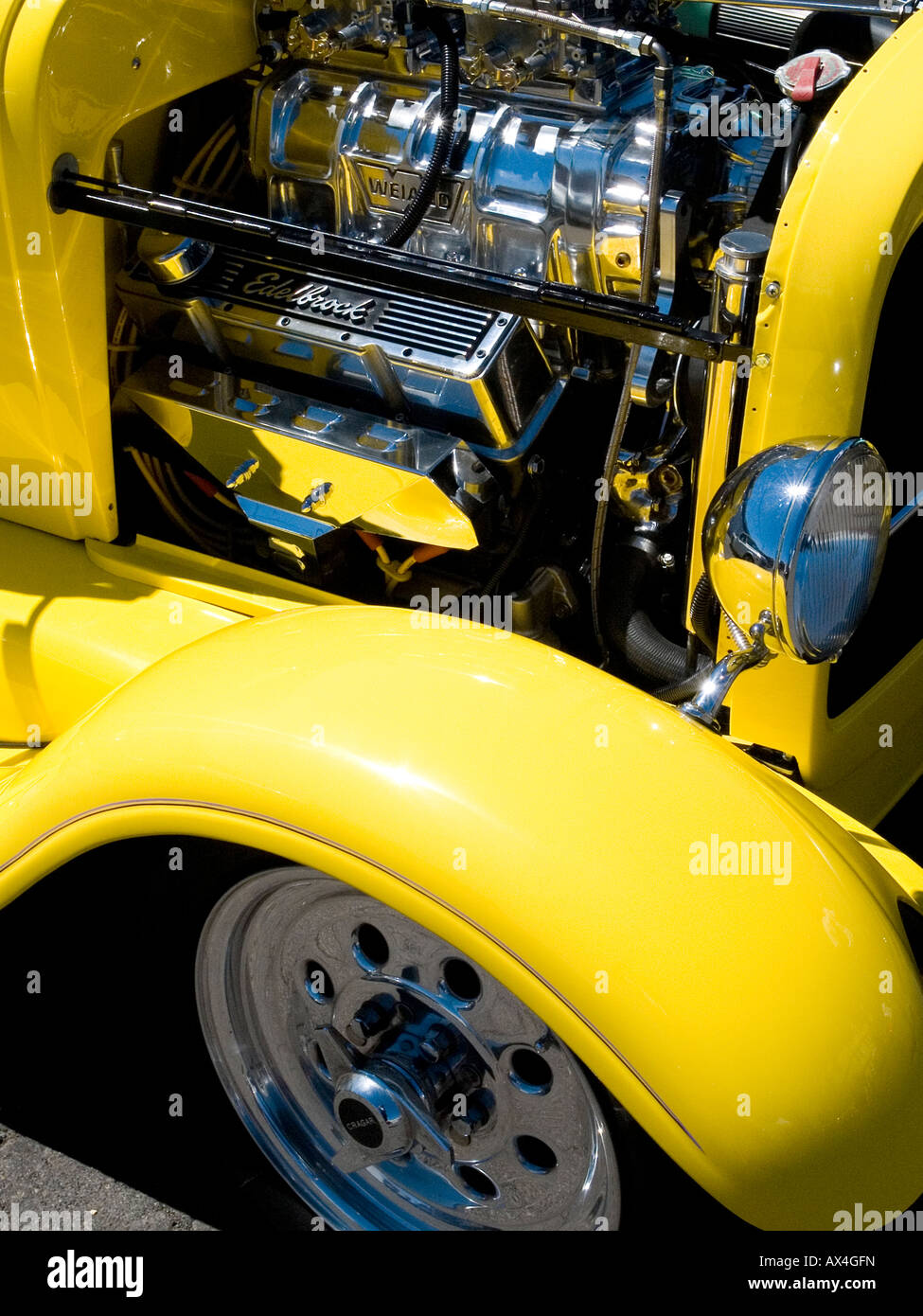 Stock image of the engine of a yellow custom built car in portrait ...
