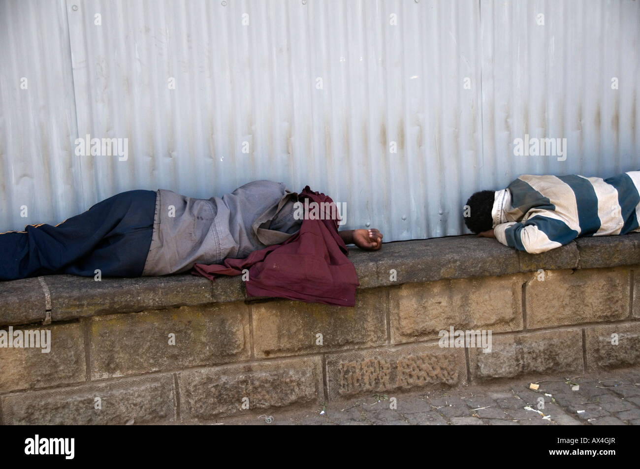 Ethiopia 2008 Homeless men asleep on a wall Stock Photo - Alamy