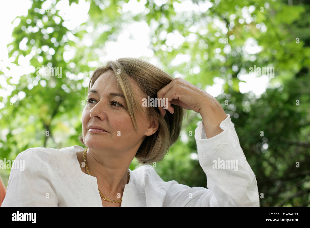 Mature woman looking sideward, portrait Stock Photo - Alamy