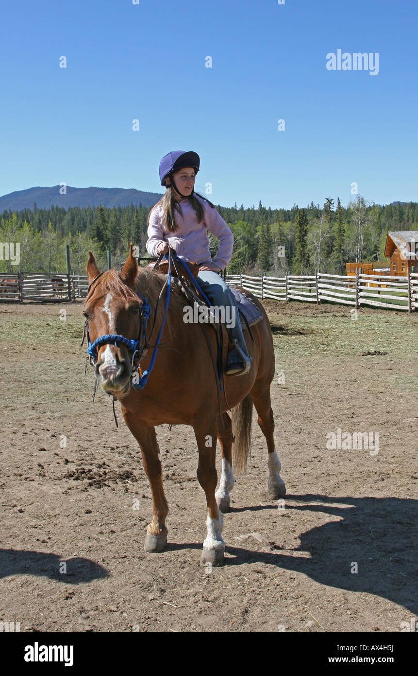 Young girl riding a chestnut horse western style Stock Photo - Alamy