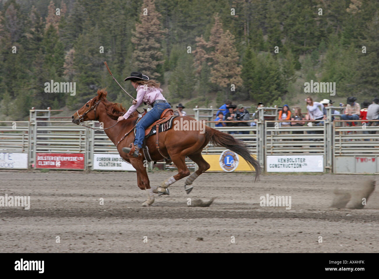 Barrel racing at a rodeo Stock Photo - Alamy