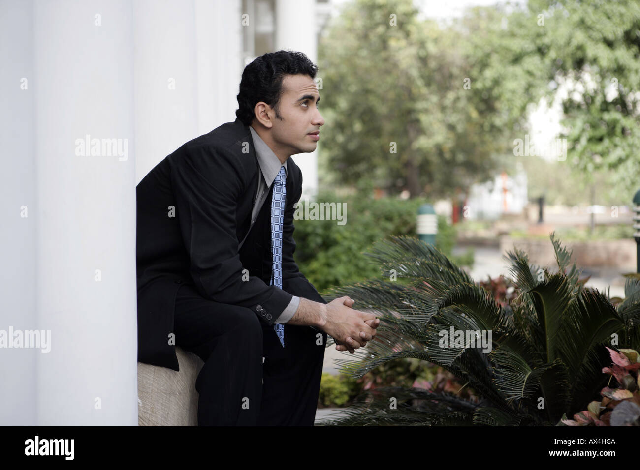 Side profile indian businessman thinking hi-res stock photography and ...