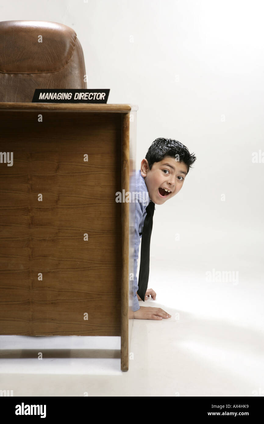 Boy peeking table hi-res stock photography and images - Alamy