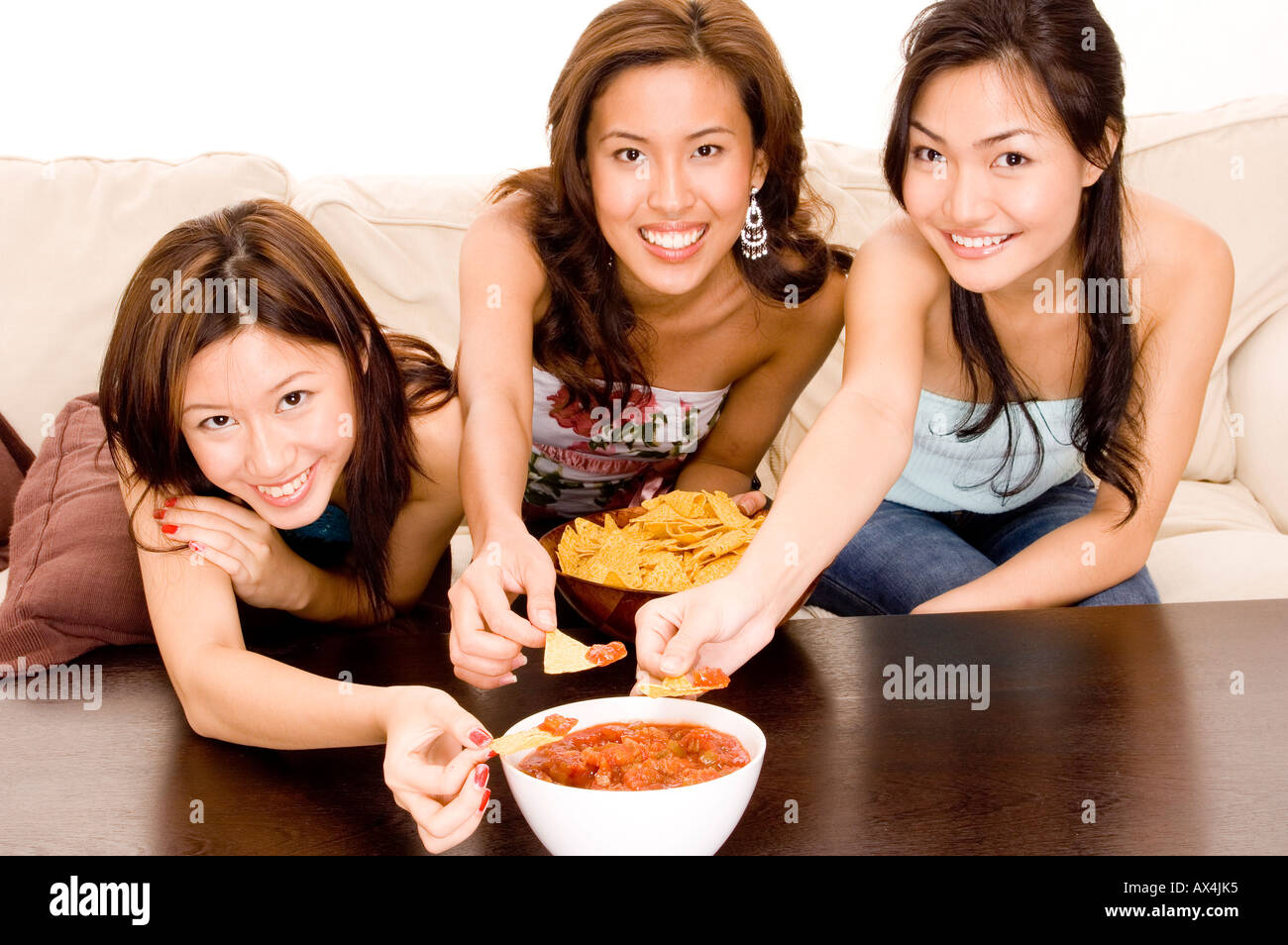 Three attractive asian women eating hi-res stock photography and images ...