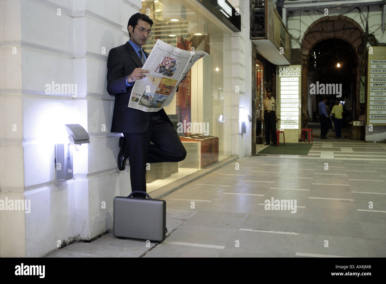 Newspaper reading at mall hi-res stock photography and images - Alamy