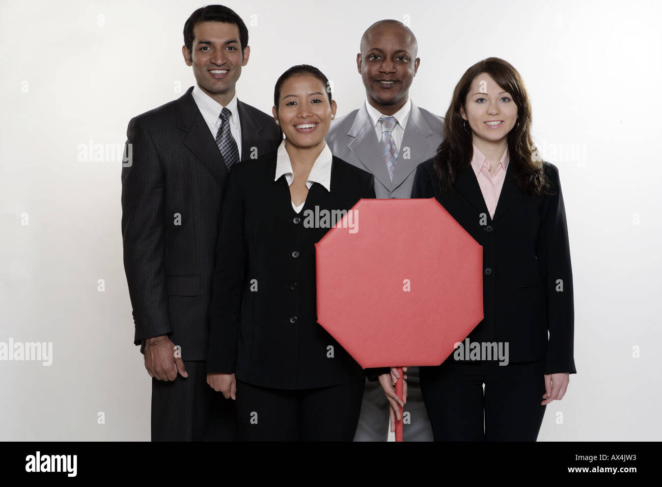 Portrait of a business team showing an information board and smiling ...