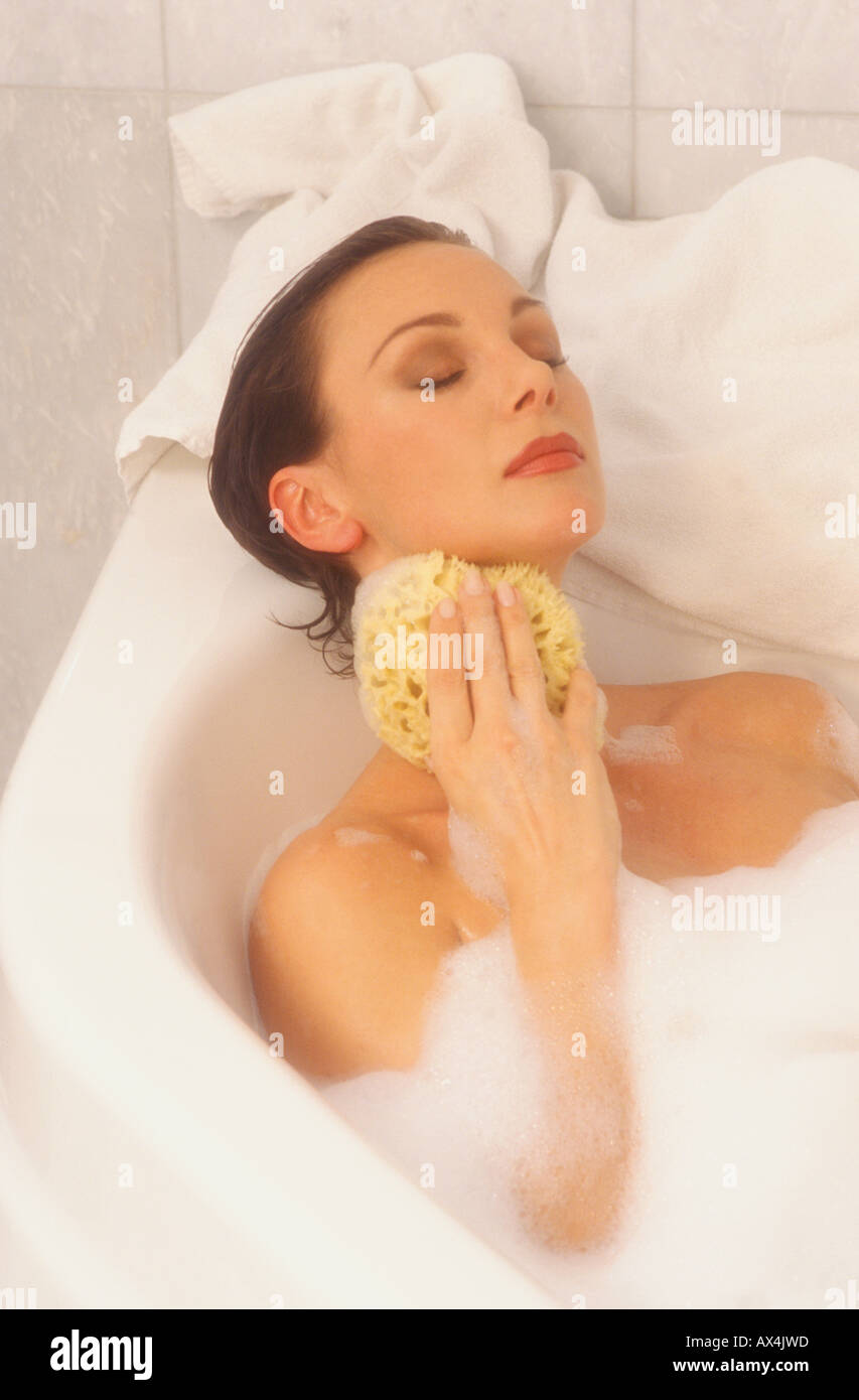 Young woman having a bath Stock Photo - Alamy