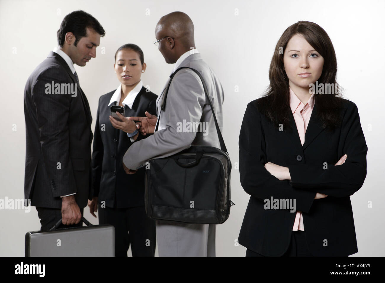 Business manager standing in front of her team Stock Photo - Alamy