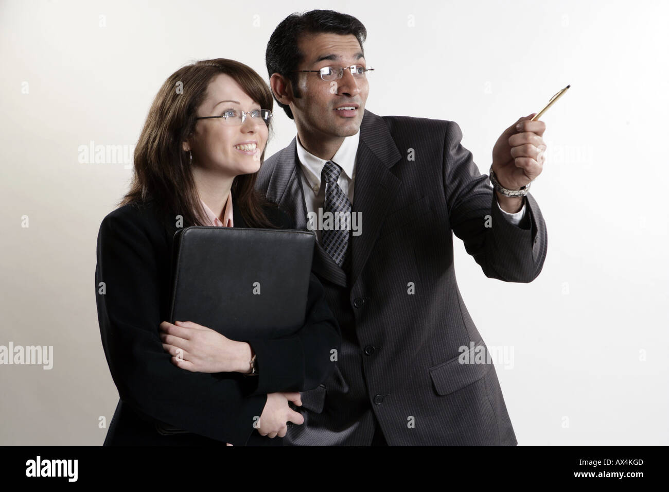 Two business people looking excited Stock Photo - Alamy