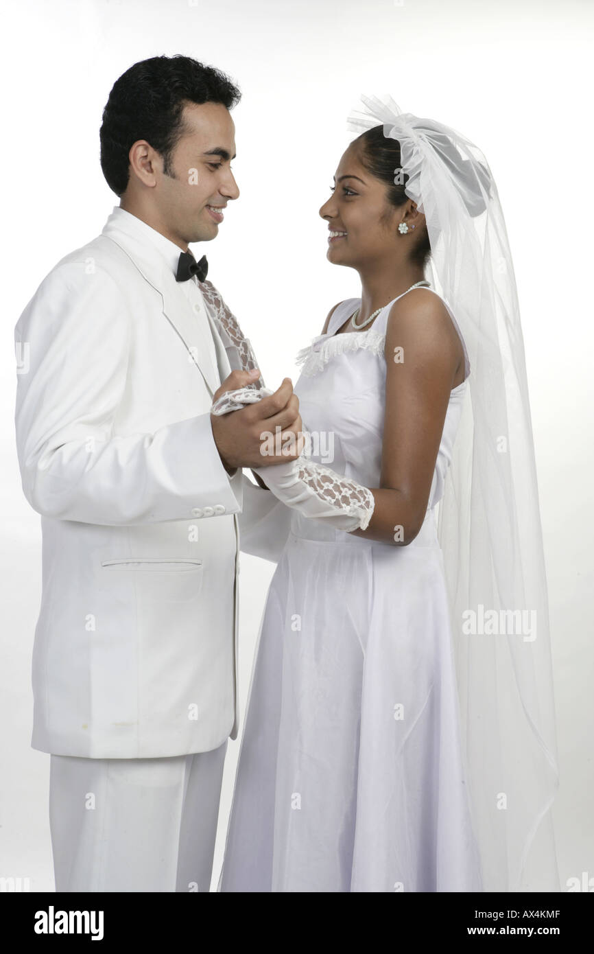 Side profile of a bride and a groom dancing and smiling Stock Photo - Alamy