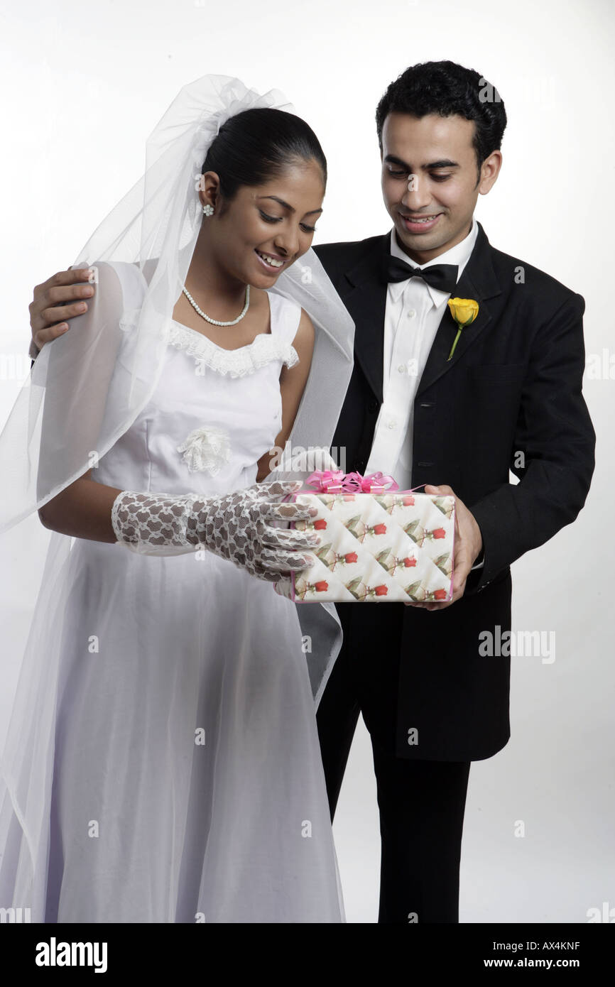 Indian man giving gift wife hi-res stock photography and images - Alamy