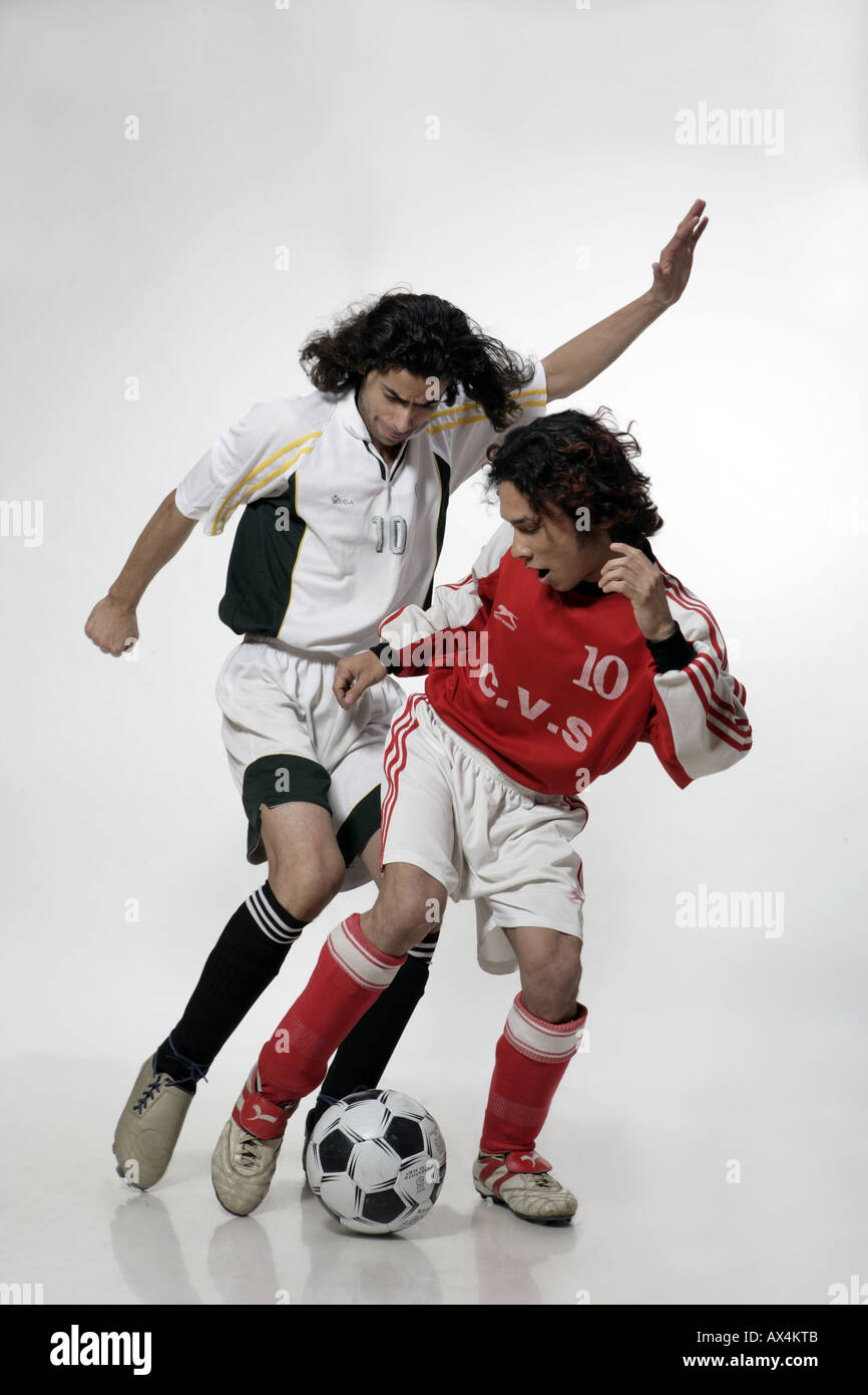 Two players playing football Stock Photo - Alamy