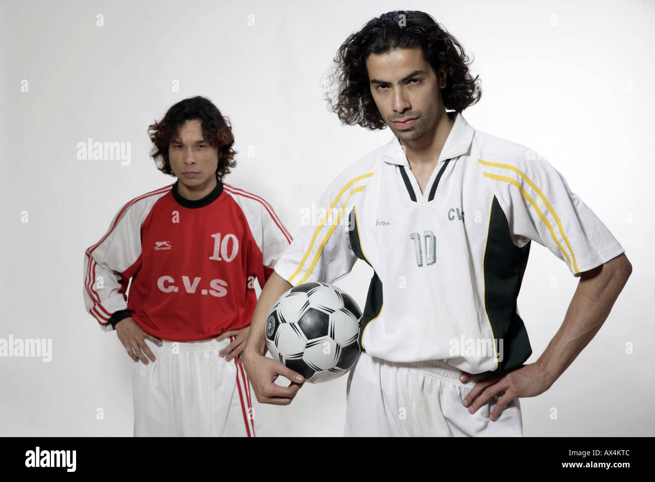 Two football players posing Stock Photo - Alamy