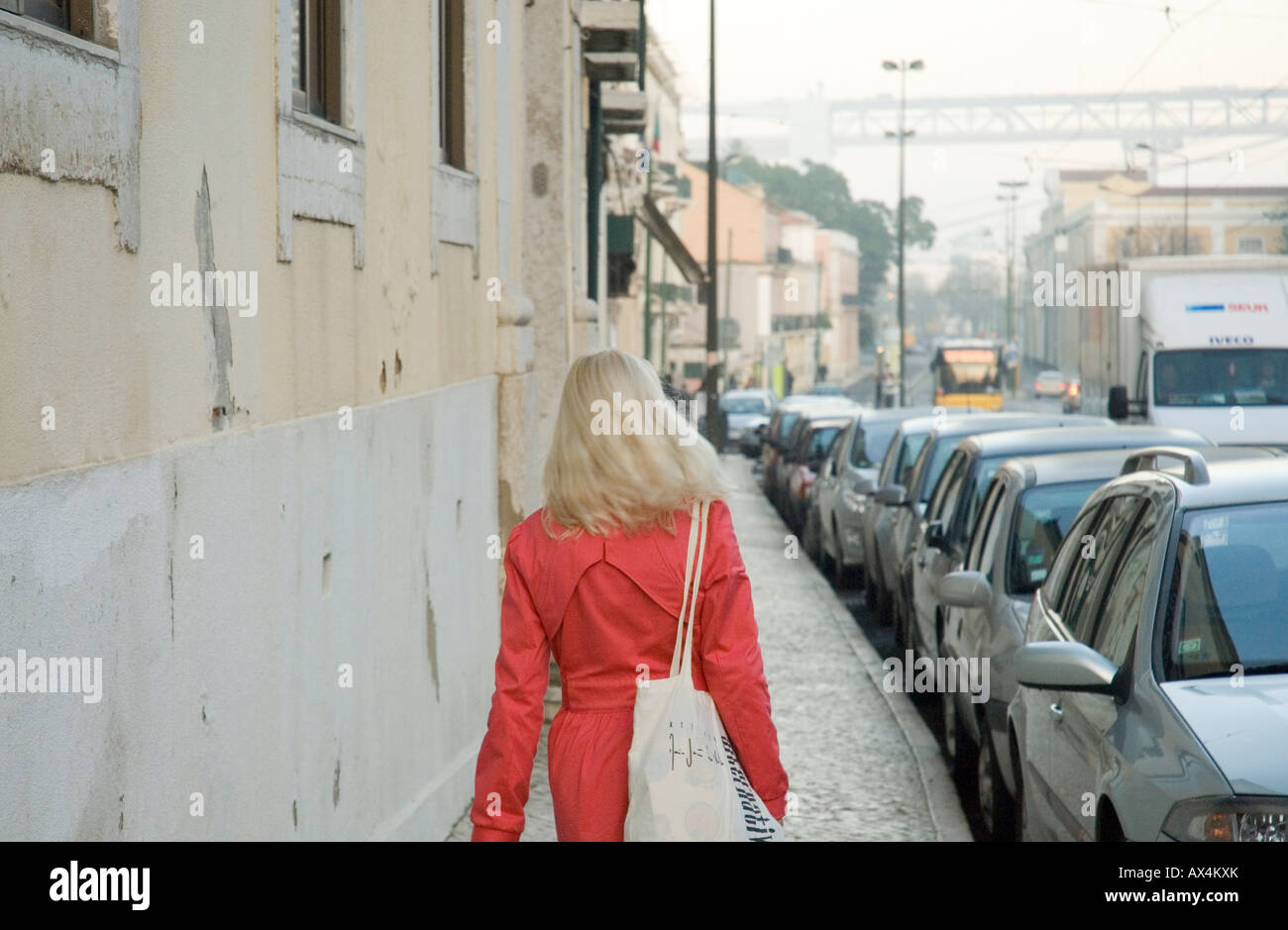 A blonde woman walking throughin Belem, Portugal Stock Photo - Alamy