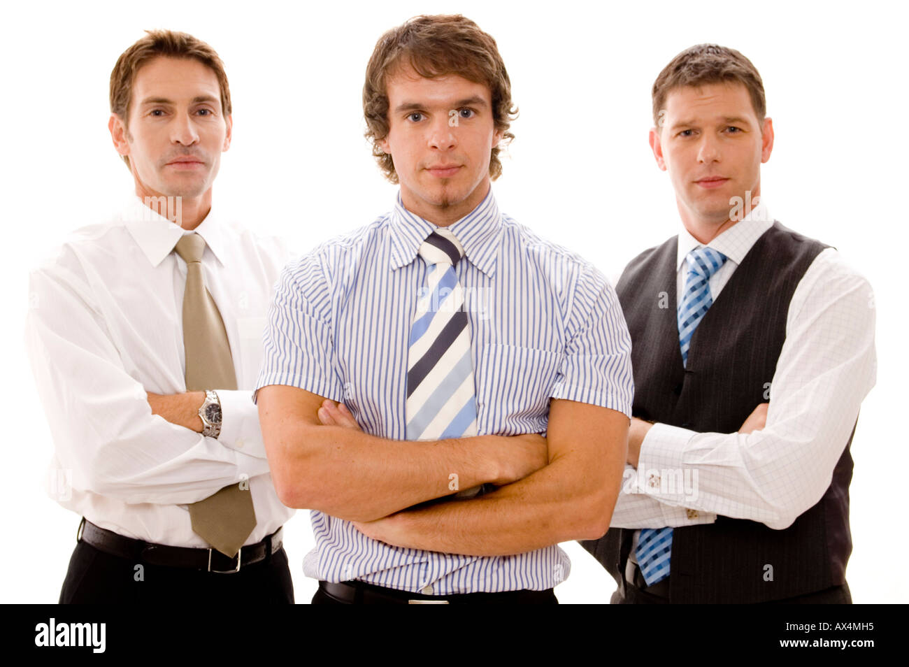 Three serious businessmen on white background Stock Photo - Alamy
