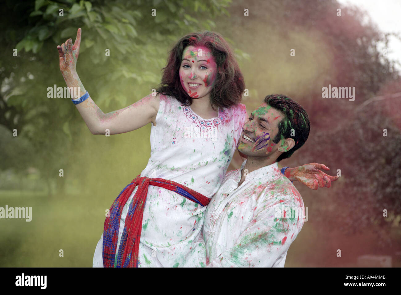 Two indian girls playing holi hi-res stock photography and images - Alamy