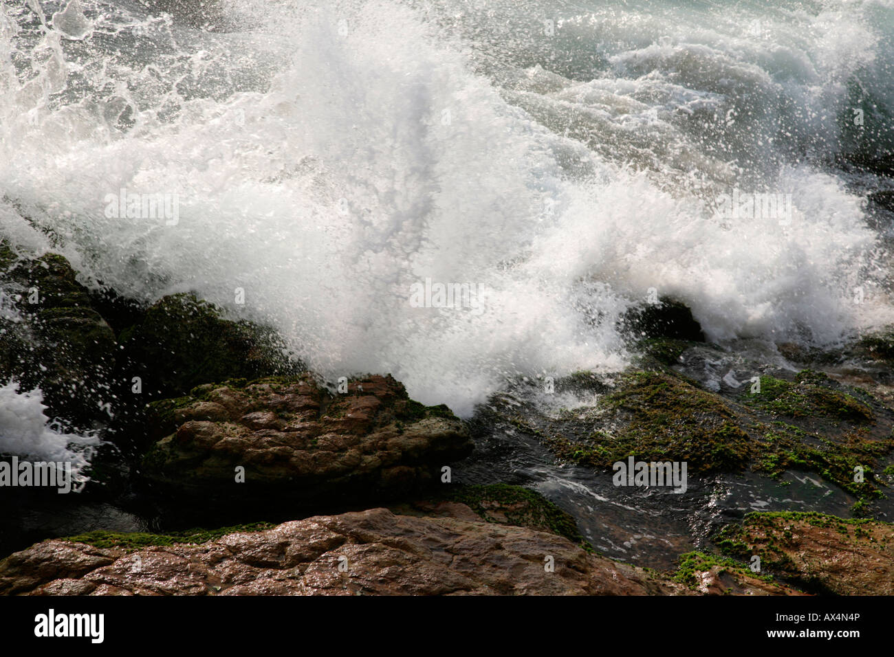 waves hitting the rock Stock Photo - Alamy