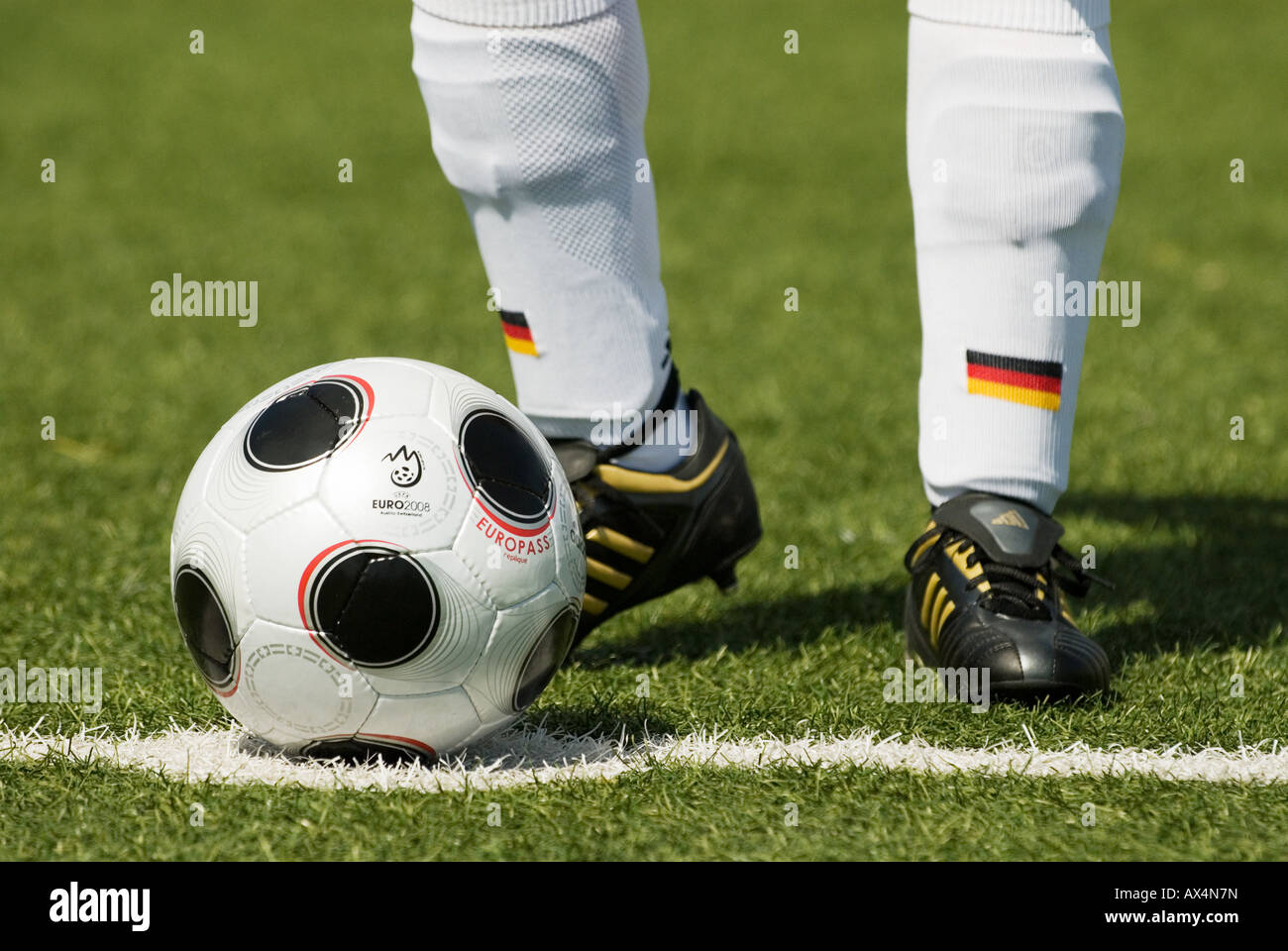 feet of a german national football player stand by a copy of EUROPASS ...
