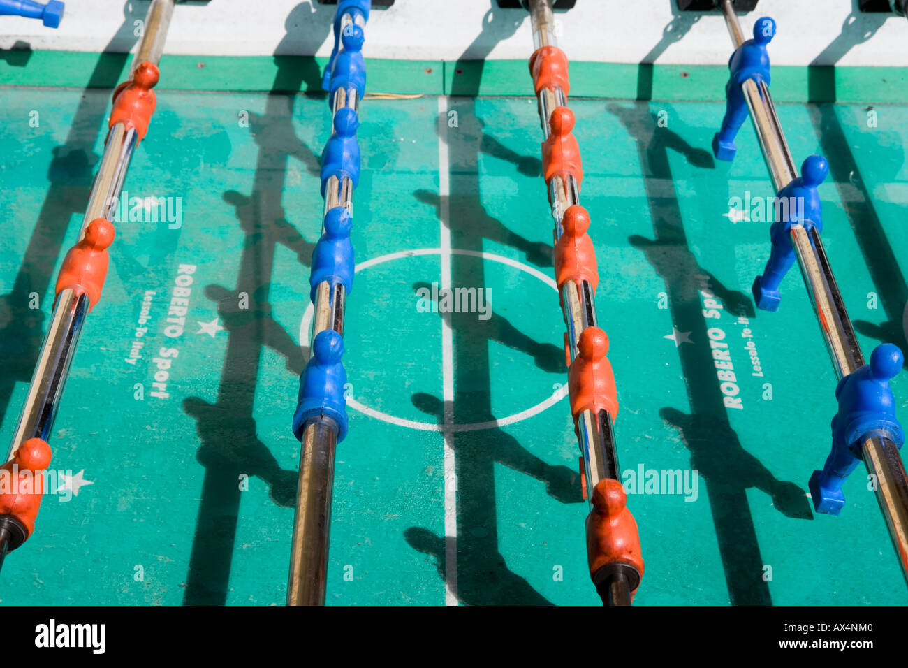 Table football with red and blue players Stock Photo - Alamy