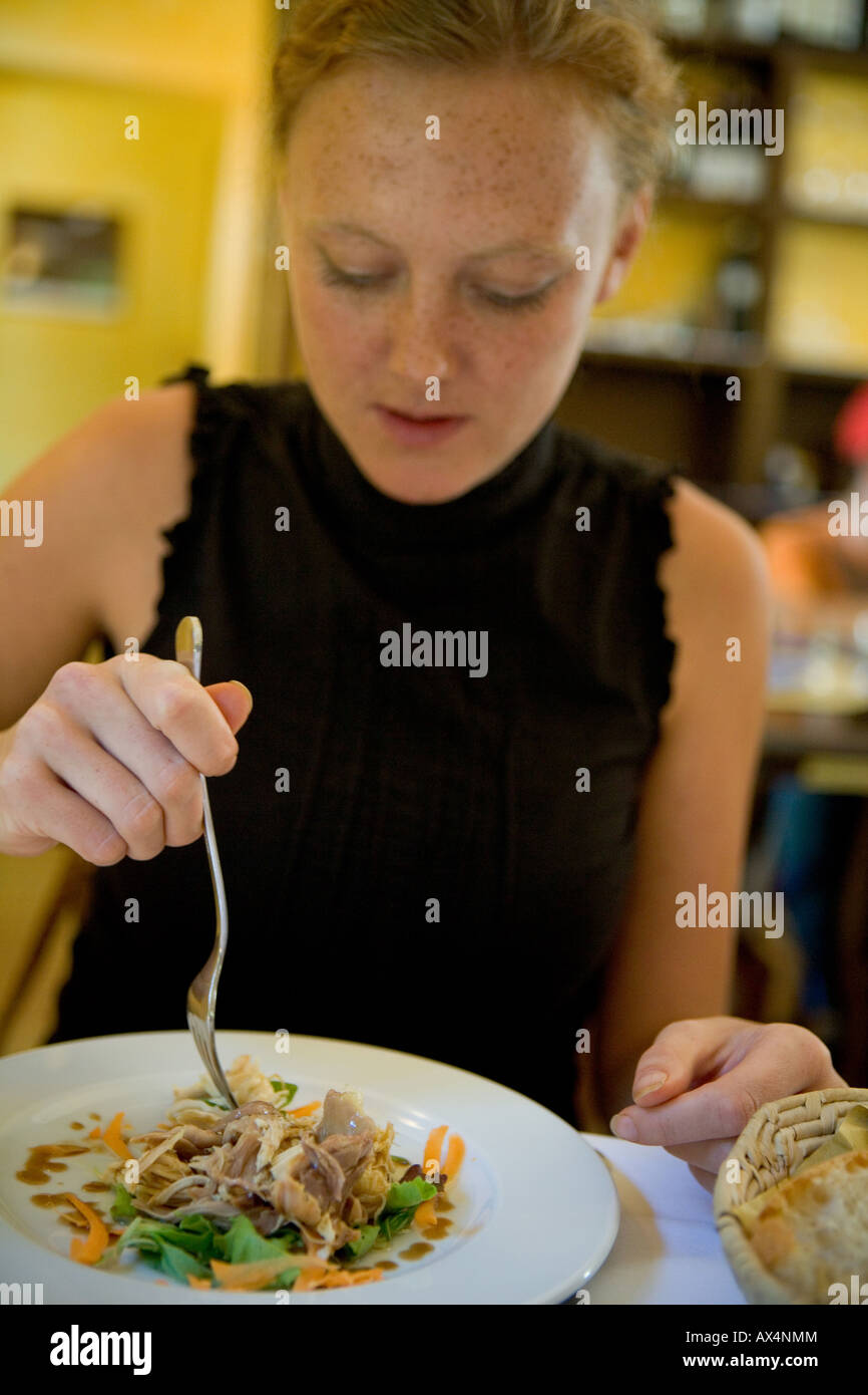 young woman eating in a restaurant Stock Photo - Alamy