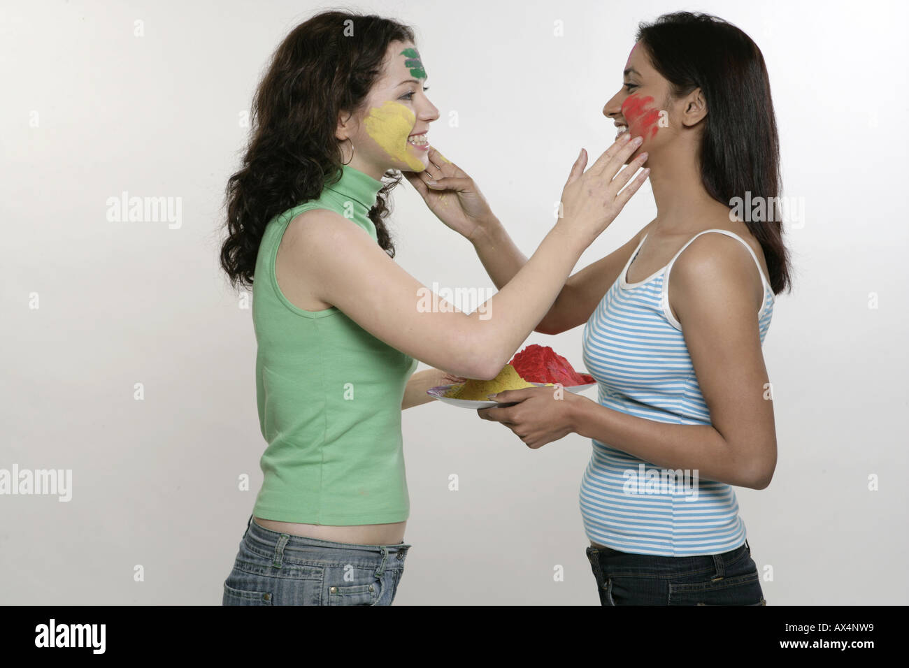 Side profile of a foreigner and a indian woman playing holi Stock Photo ...