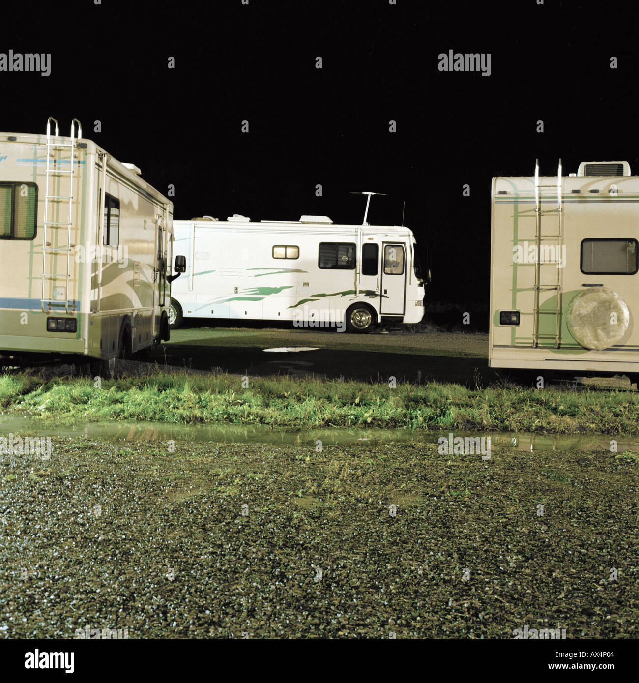Three trailers in a parking lot Stock Photo - Alamy