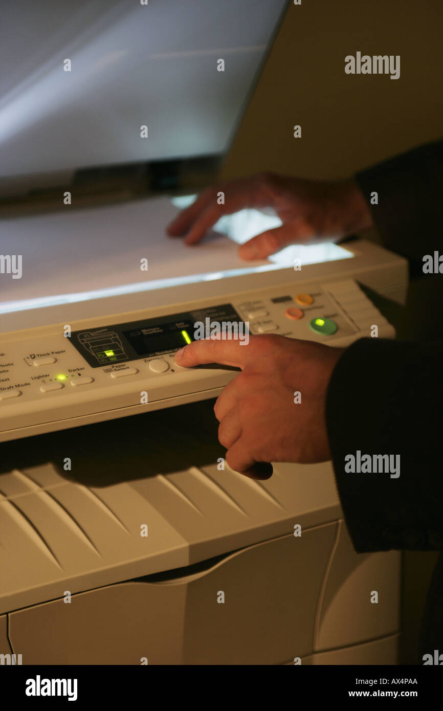 Man using a photocopier Stock Photo - Alamy