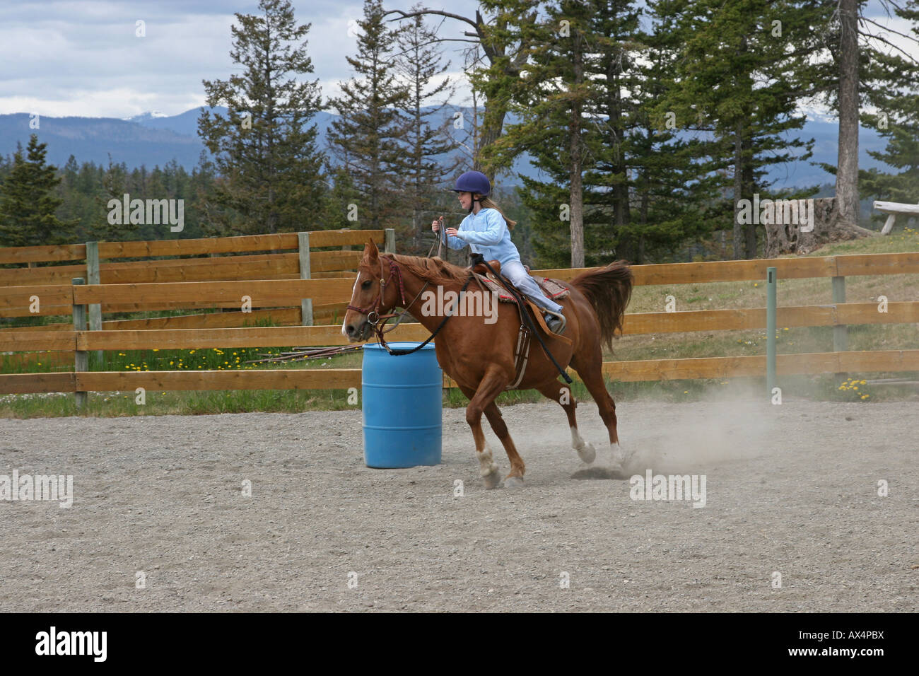 Young girl practising barrel racing Stock Photo - Alamy