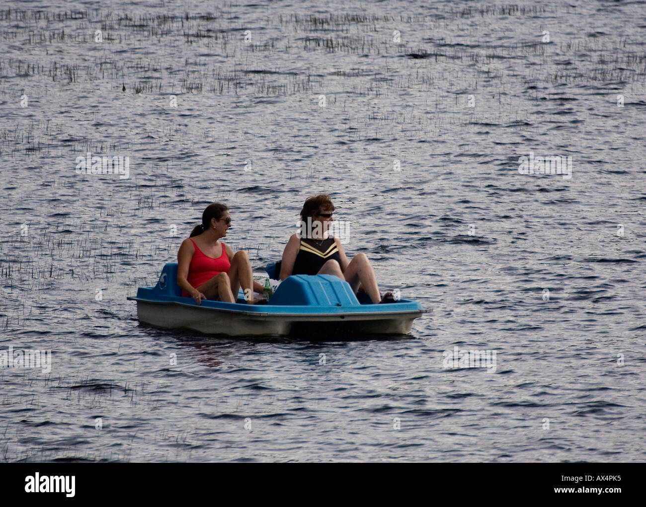 Two ladies paddle boating hi-res stock photography and images - Alamy