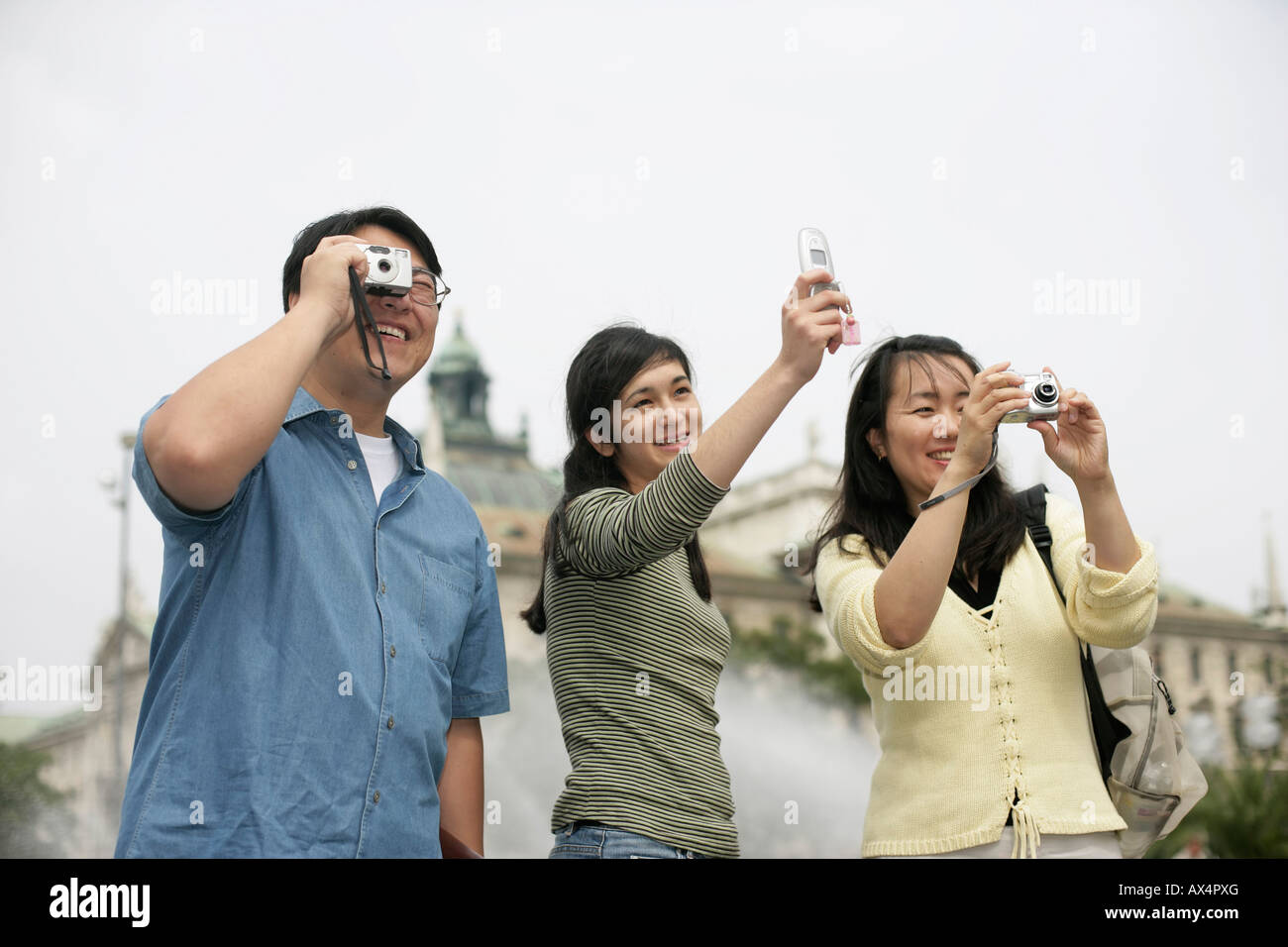 Woman taking pictures low angle hi-res stock photography and images - Alamy