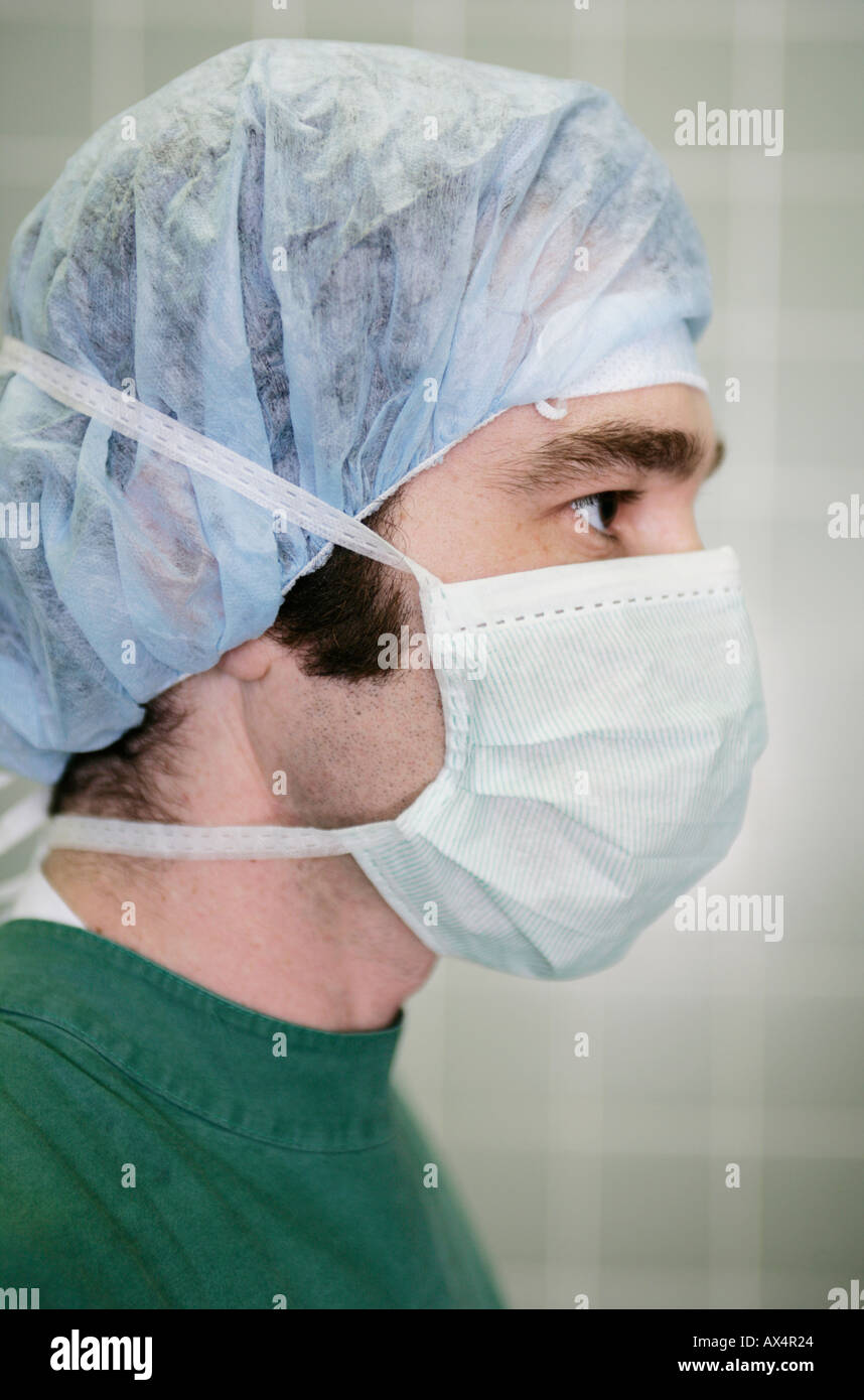 A surgeon wearing surgical mask and cap Stock Photo - Alamy