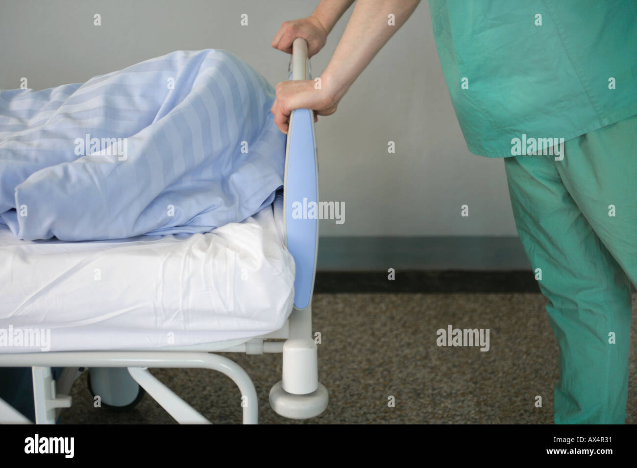 Nurse pushing a hospital gurney Stock Photo - Alamy