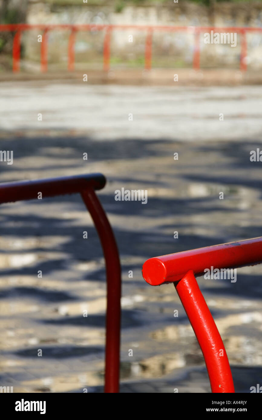 red metal hand rail in play area in park Stock Photo - Alamy