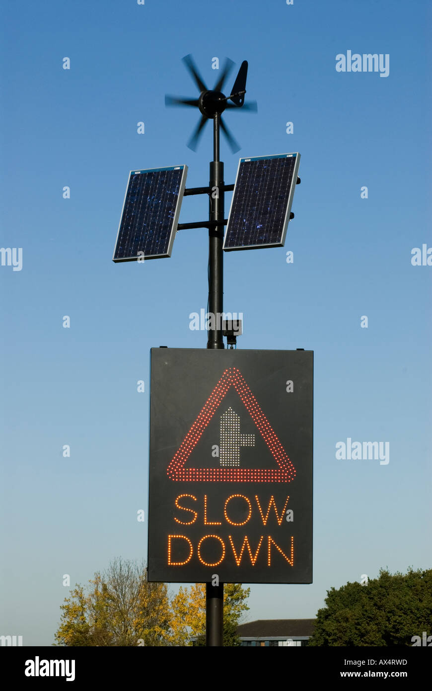 SLOW DOWN SAFETY ROAD SIGN CAMBRIDGESHIRE ENGLAND USING WIND AND SOLAR ...