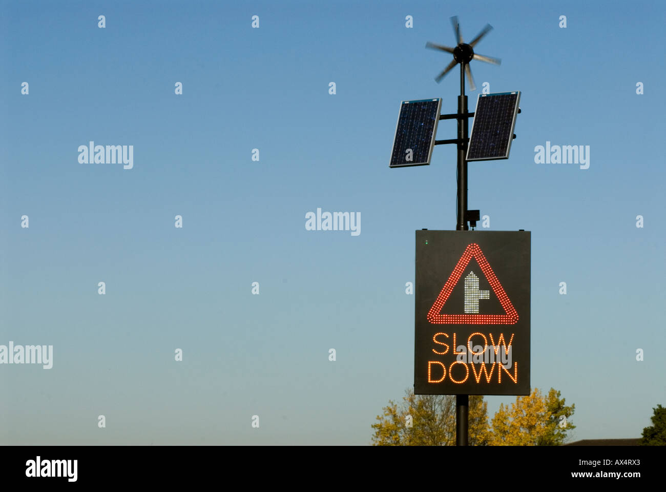 SLOW DOWN SAFETY ROAD SIGN CAMBRIDGESHIRE ENGLAND USING WIND AND SOLAR ...