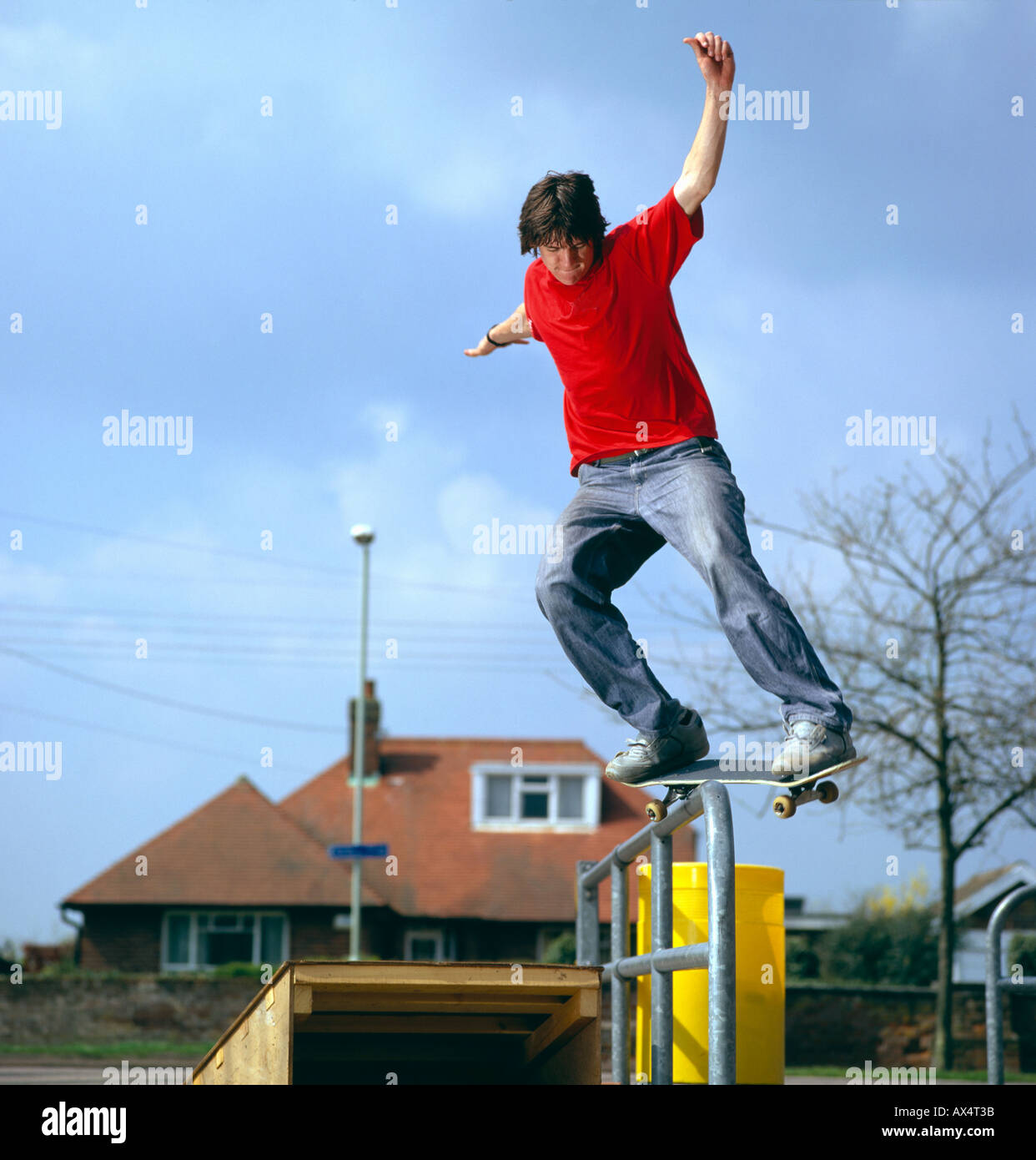 Man on skateboard balancing on railing Stock Photo - Alamy