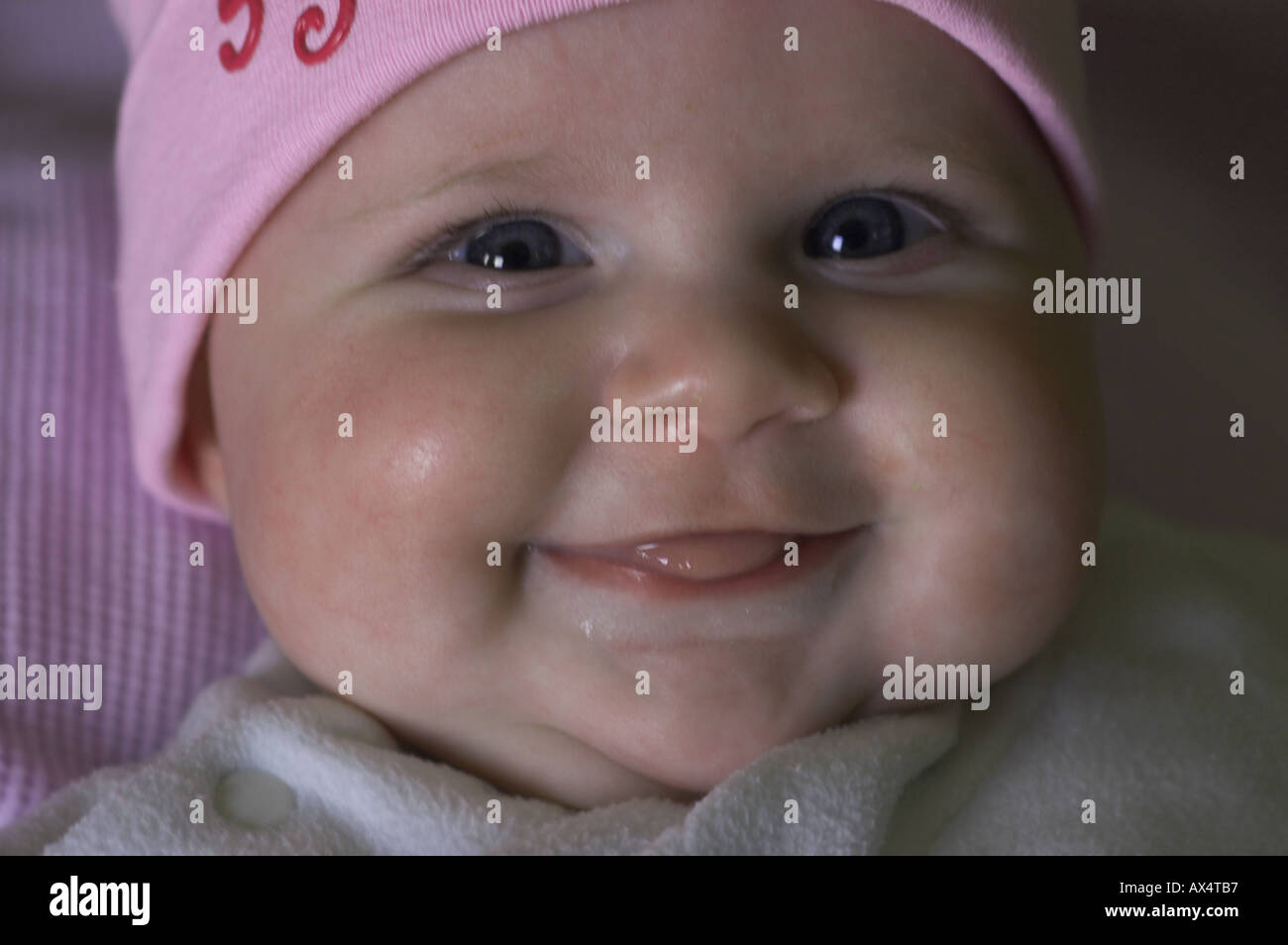 Baby girl smiles looking up hi-res stock photography and images - Alamy